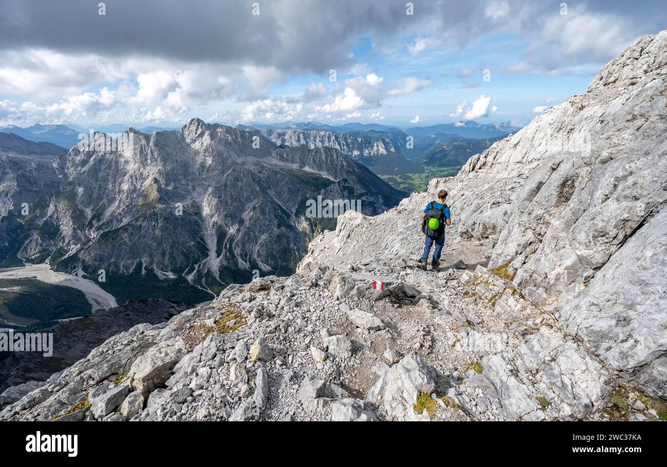 Mountaineer on a narrow rocky ridge, Watzmann crossing to the Watzmann ...