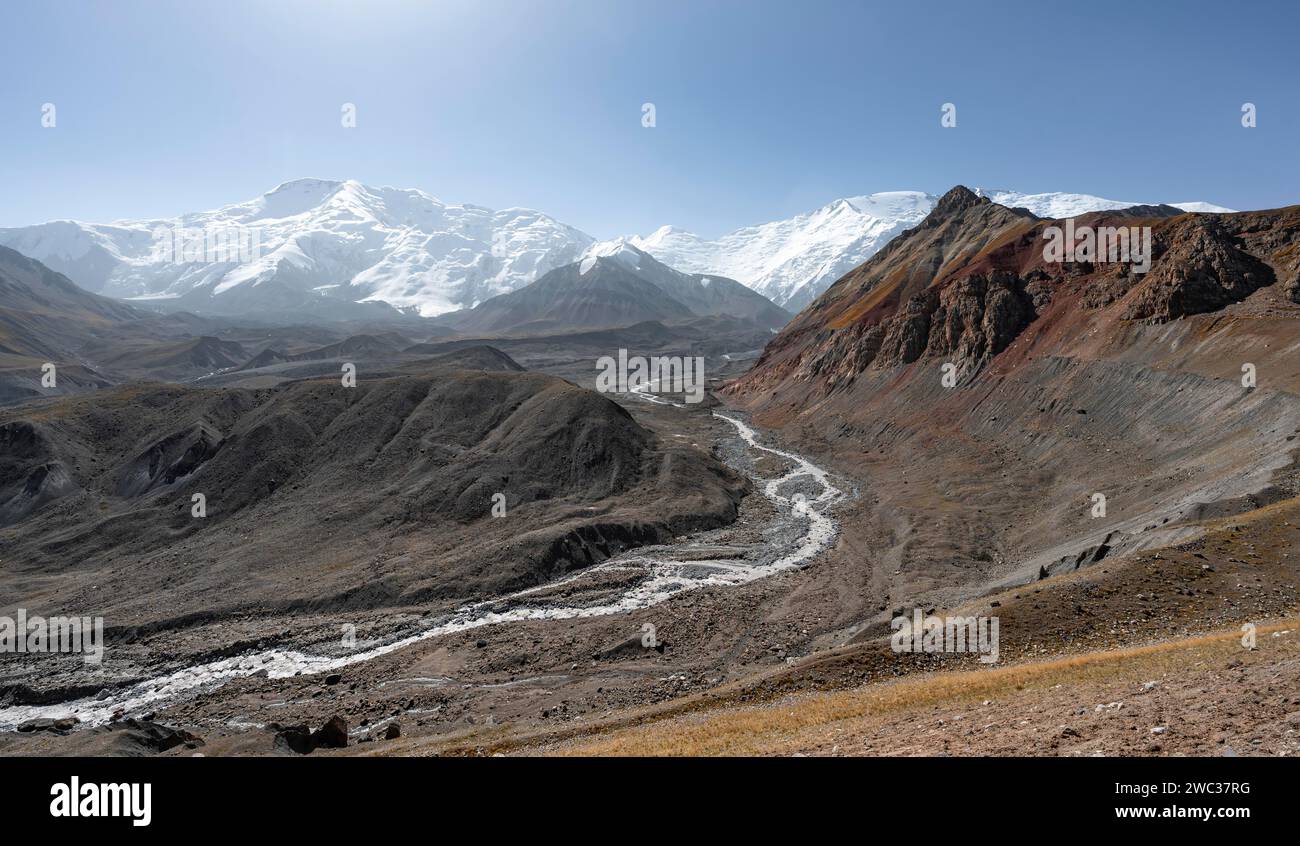 Valley with river Achik Tash, behind glaciated and snow-covered ...