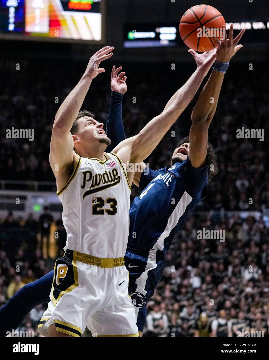 Purdue forward Camden Heide (23) and Penn State forward Puff Johnson (4 ...