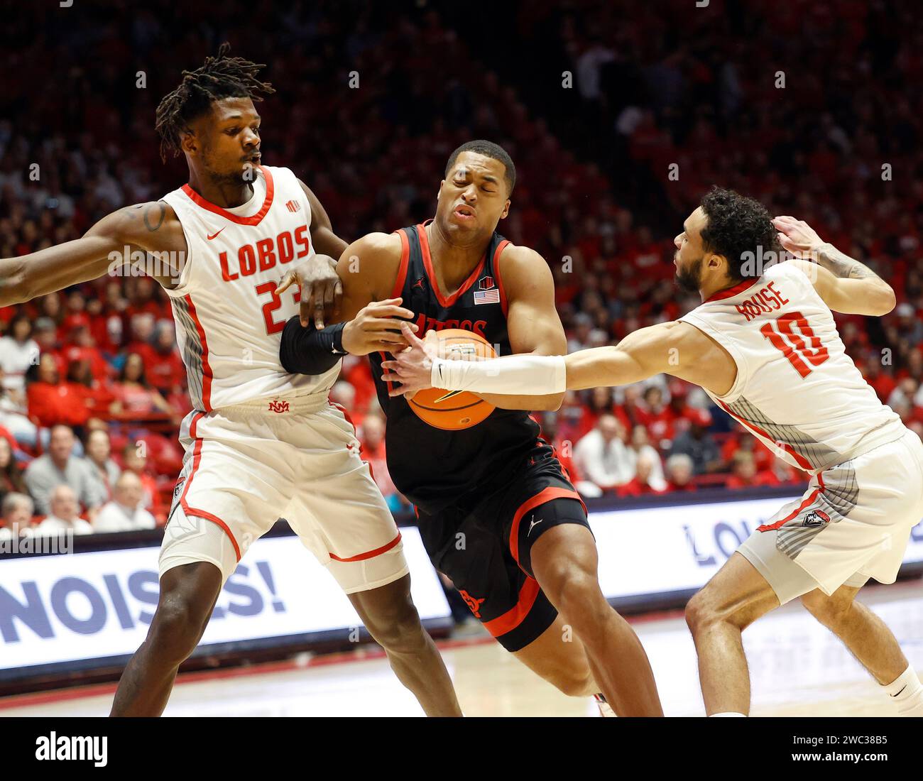 San Diego State forward Jaedon LeDee attempts to dribble between New ...