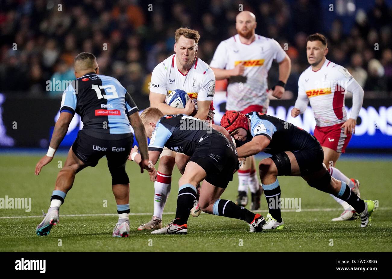 Harlequins' Alex Dombrandt is tackled by Cardiff's James Botham and ...