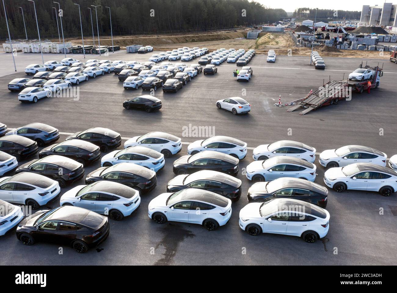 Tesla Y models produced in the Tesla Giga Factory are loaded onto car ...
