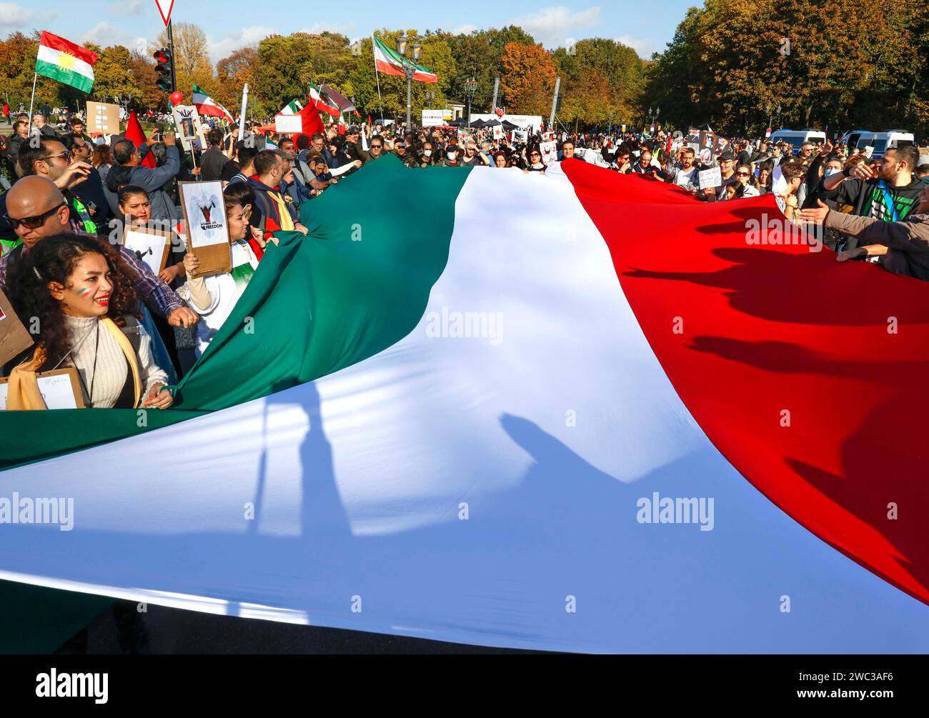Iranians demonstrate in Berlin with a large Iranian flag to support the ...