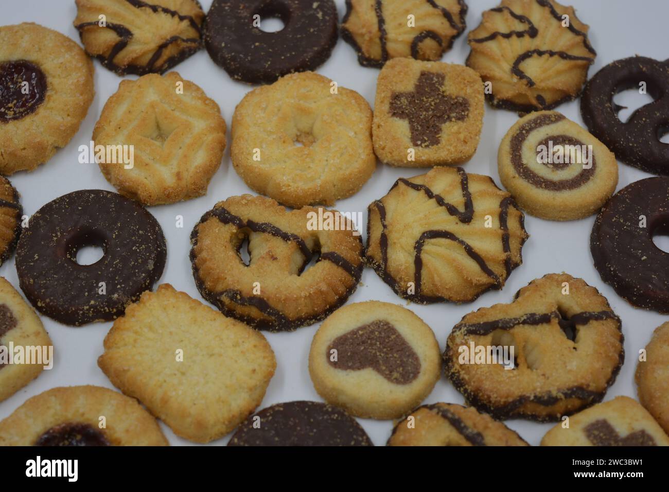 A bright assortment of shortbread cookies covered with chocolate and ...