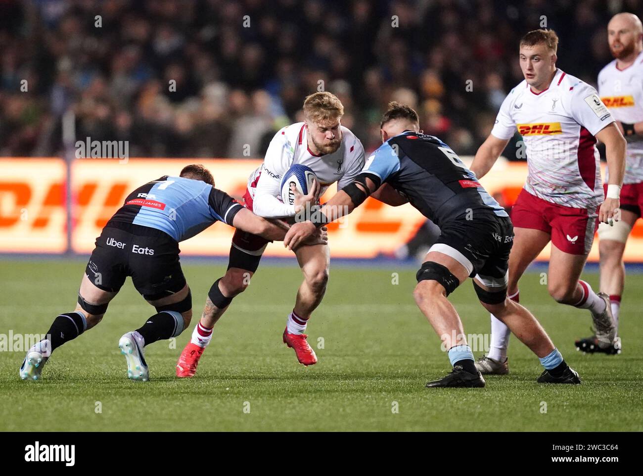 Harlequins' Tyrone Green is tackled by Cardiff's Thomas Young (left ...