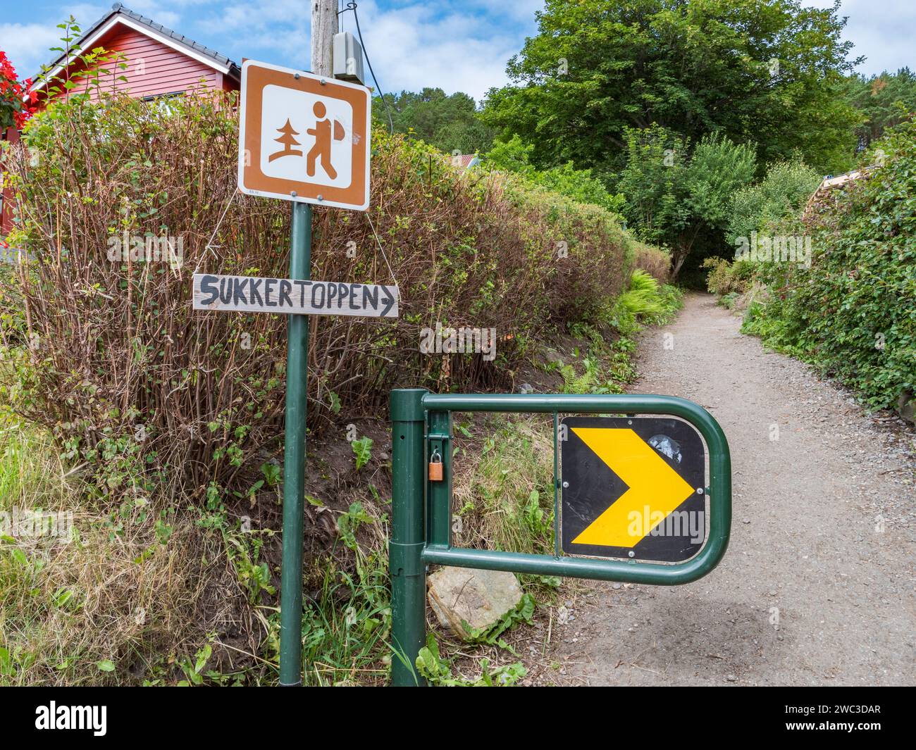 Footpath entrance leading to the summit of Sukkertoppen in Alesund ...