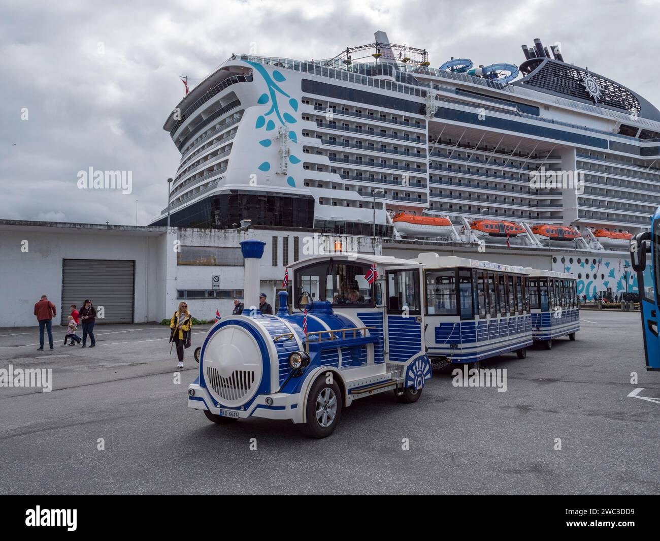 Tourist train waiting for guests under the MSC Euribia cruise ship ...