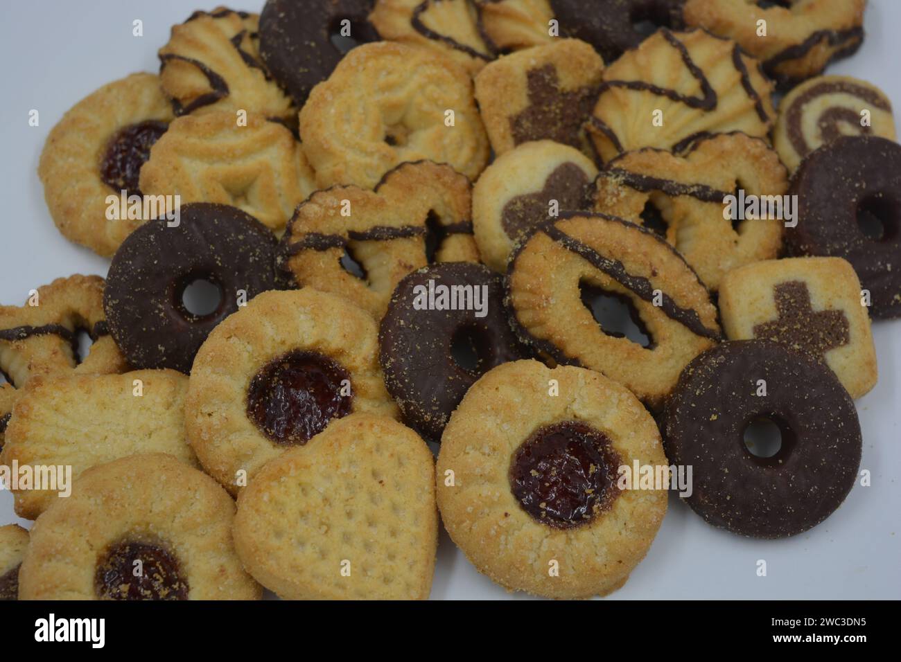 A bright assortment of shortbread cookies covered with chocolate and ...