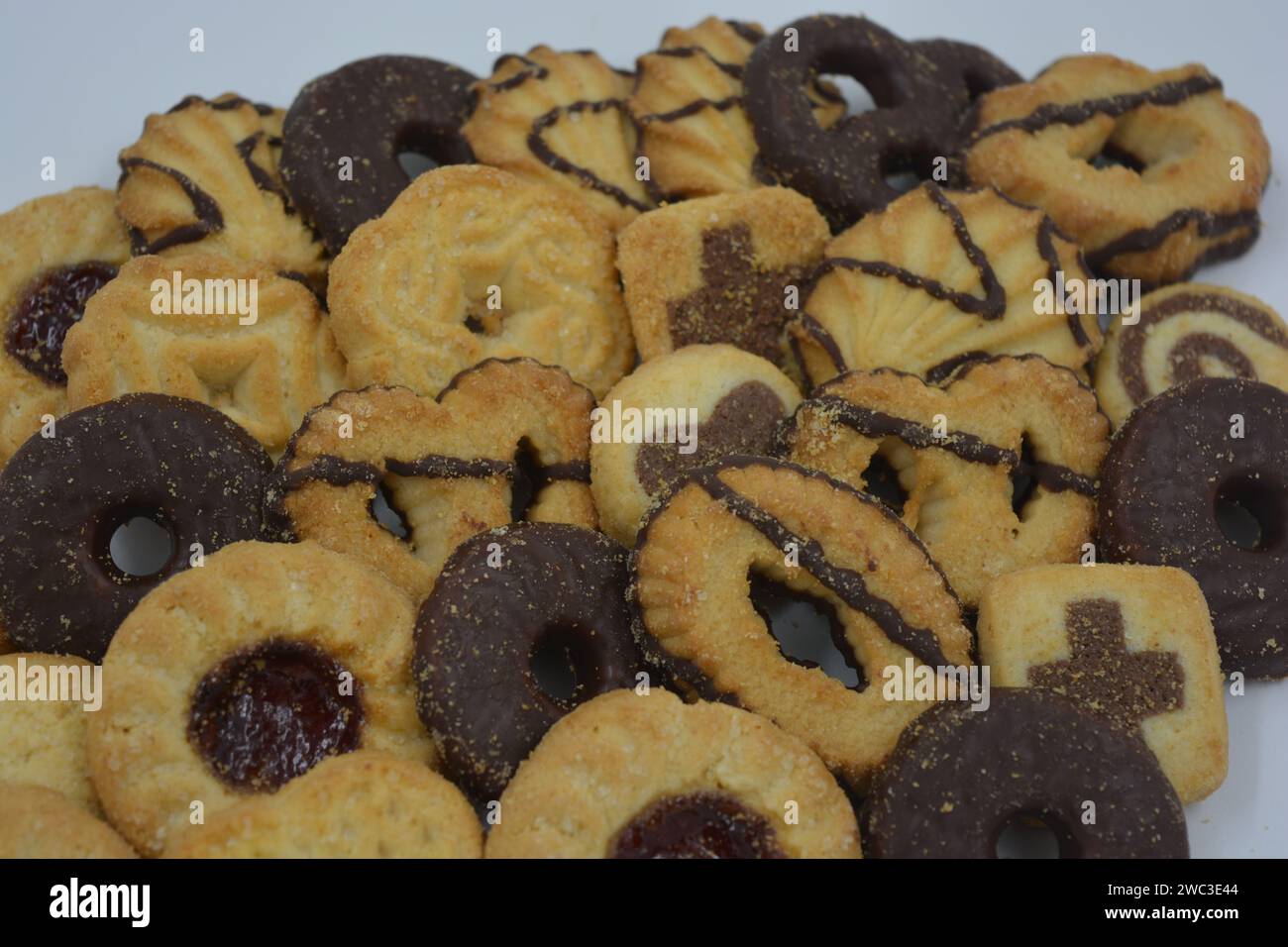 A bright assortment of shortbread cookies covered with chocolate and ...