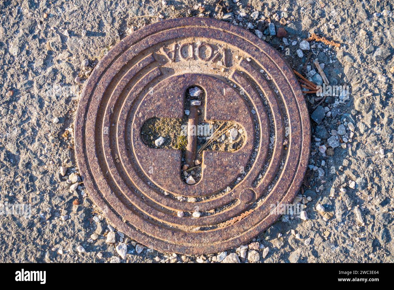 Texture of Metal cover for water, sewer manhole, With the inscription ...