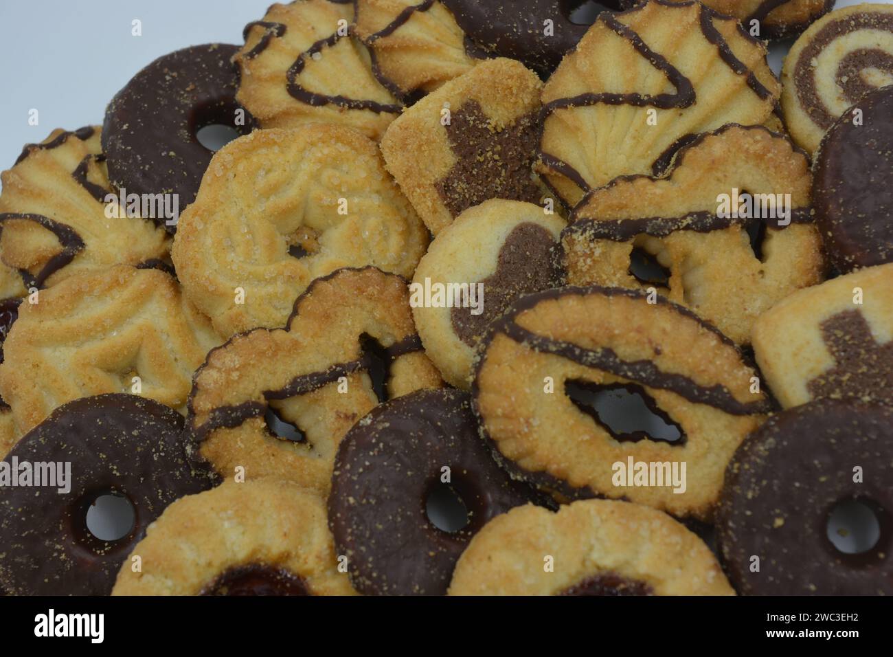 A bright assortment of shortbread cookies covered with chocolate and ...
