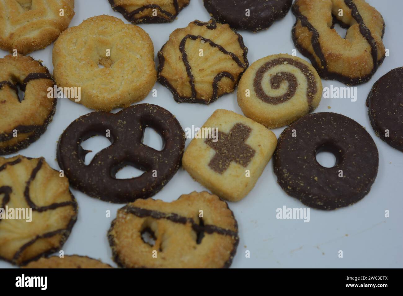 A bright assortment of shortbread cookies covered with chocolate and ...