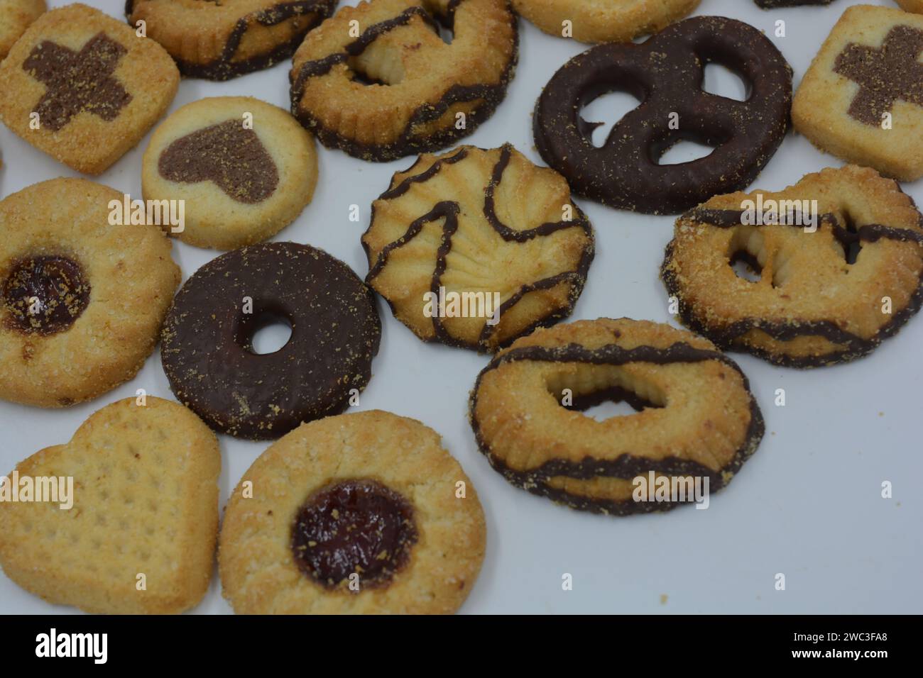 A bright assortment of shortbread cookies covered with chocolate and ...