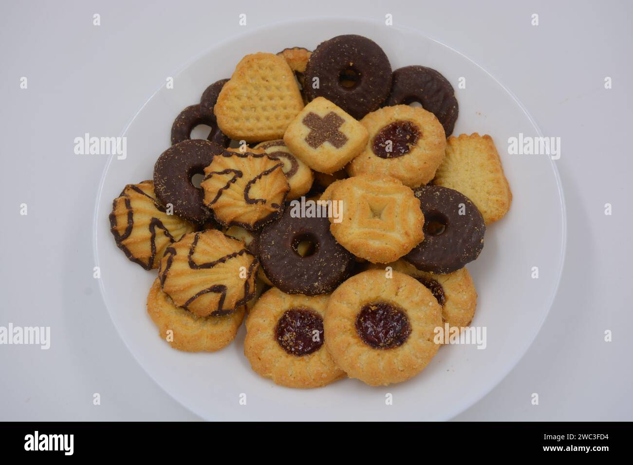 A bright assortment of shortbread cookies covered with chocolate and ...