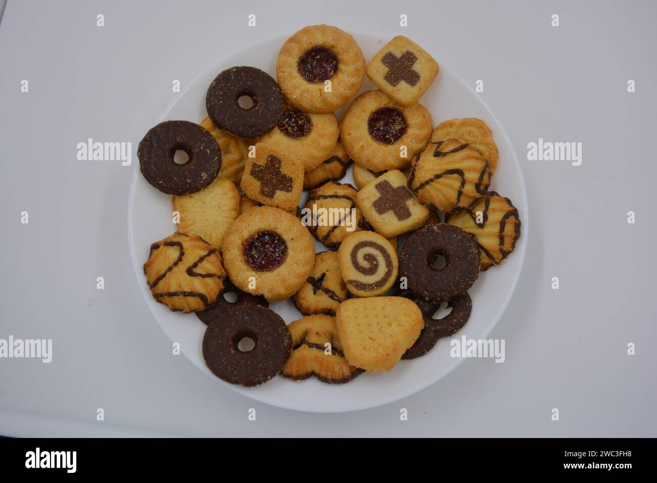 A bright assortment of shortbread cookies covered with chocolate and ...