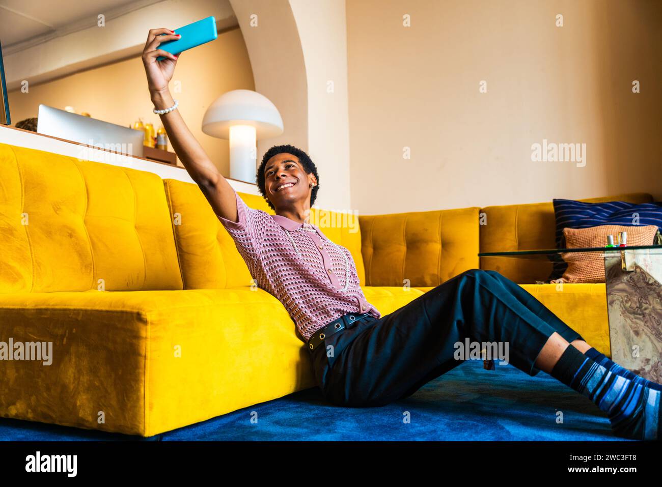 Fluid gender young man wearing cross dressing clothing at home, LGBTQ ...