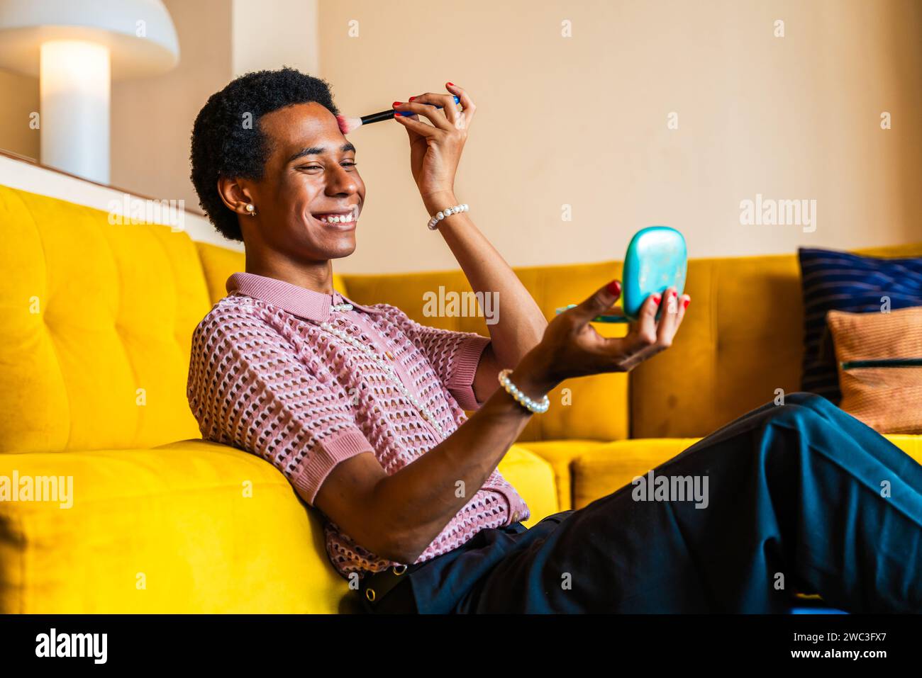 Fluid gender young man wearing cross dressing clothing at home, LGBTQ ...