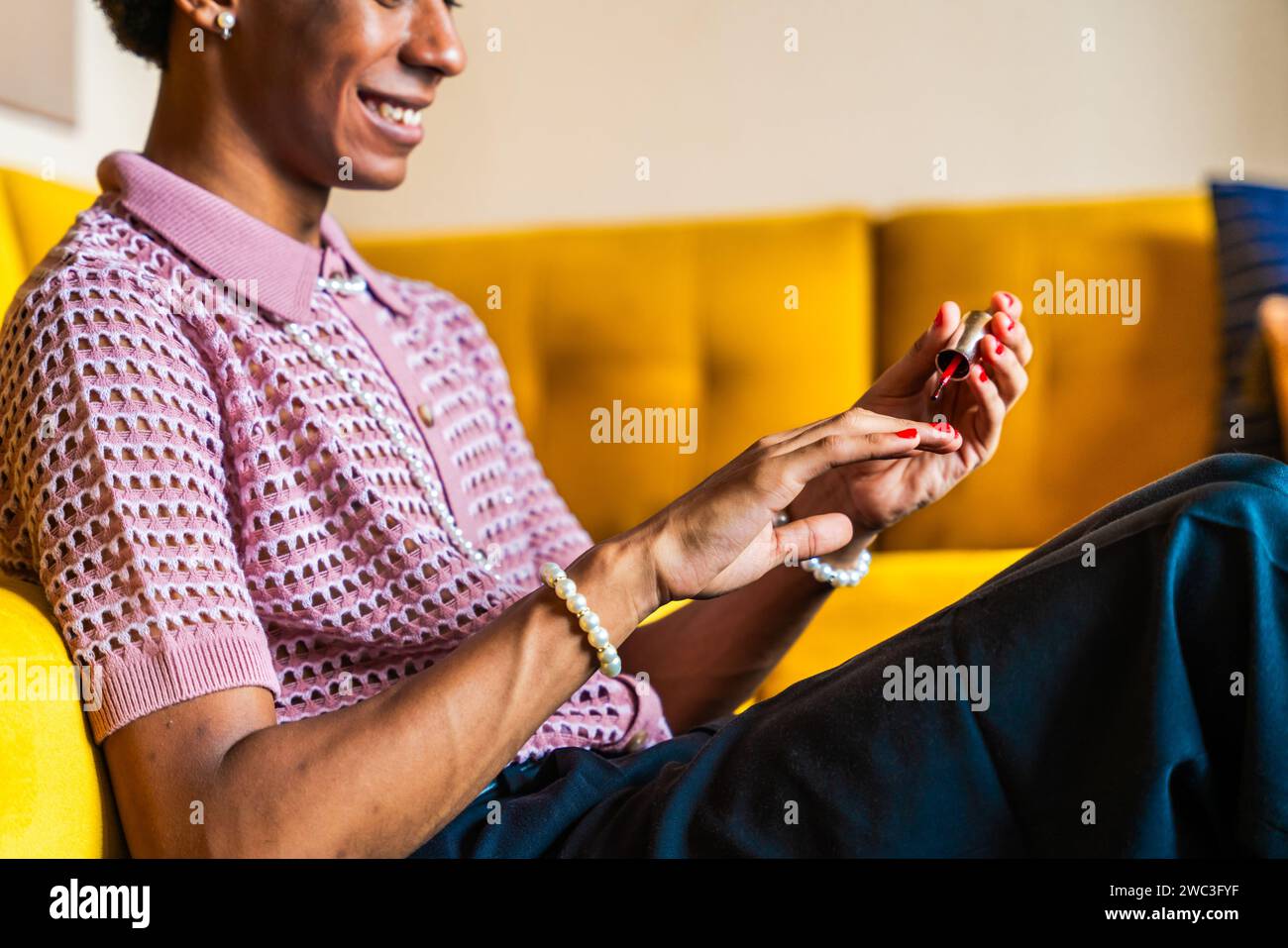 Fluid gender young man wearing cross dressing clothing at home, LGBTQ ...