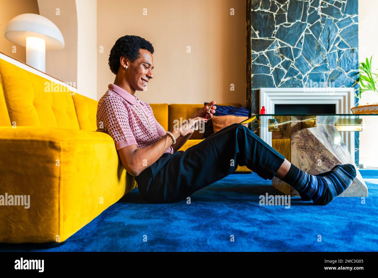 Fluid gender young man wearing cross dressing clothing at home, LGBTQ ...