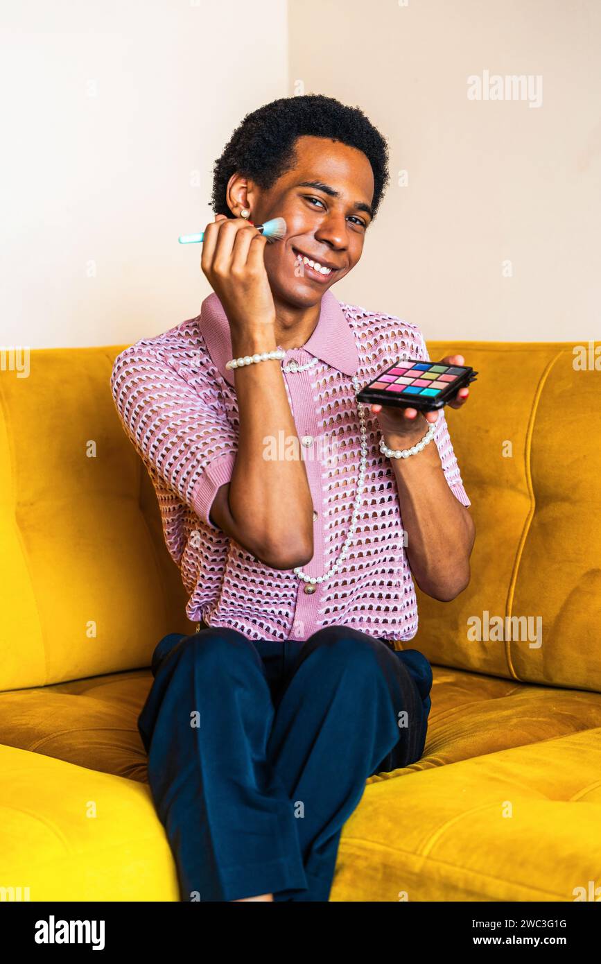 Fluid gender young man wearing cross dressing clothing at home, LGBTQ ...