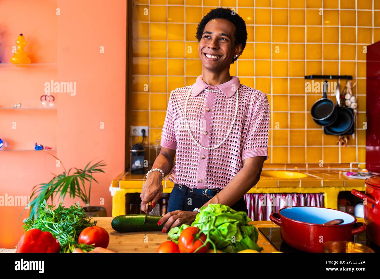 Fluid gender young man wearing cross dressing clothing at home, LGBTQ ...