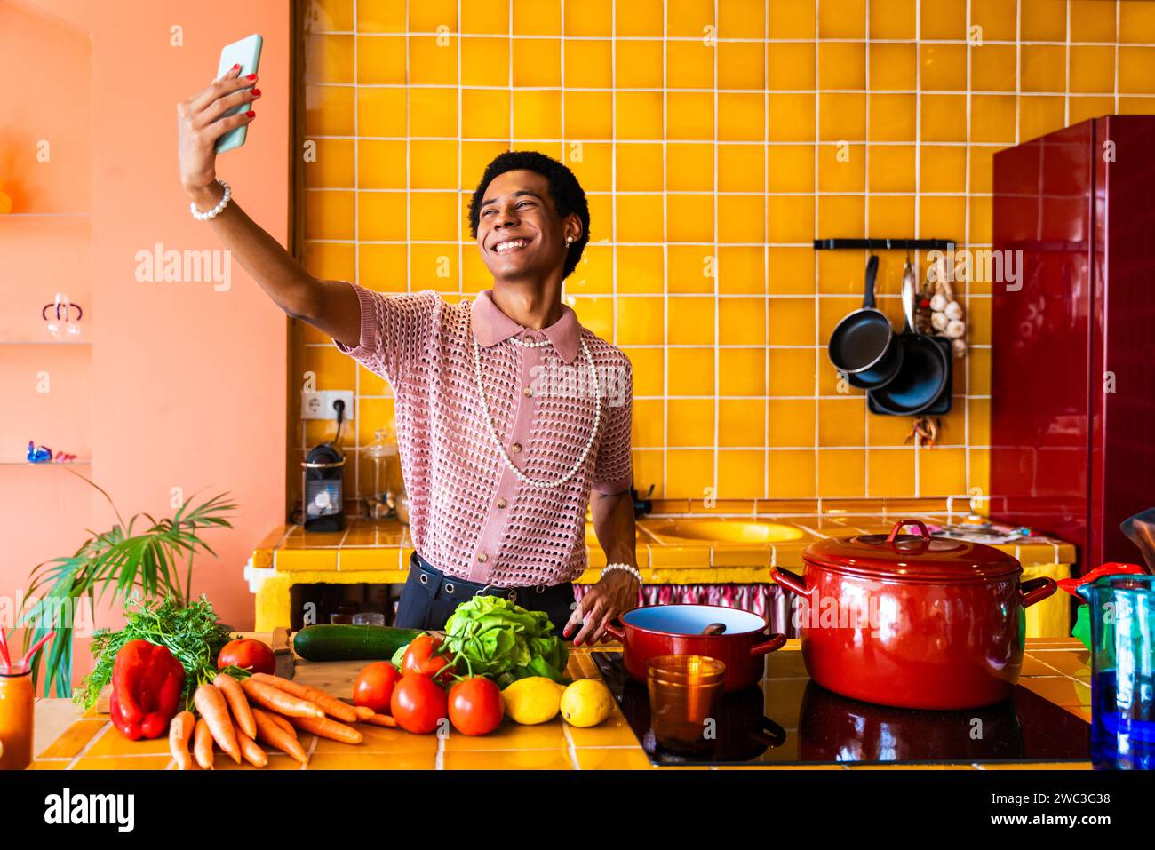 Fluid gender young man wearing cross dressing clothing at home, LGBTQ ...