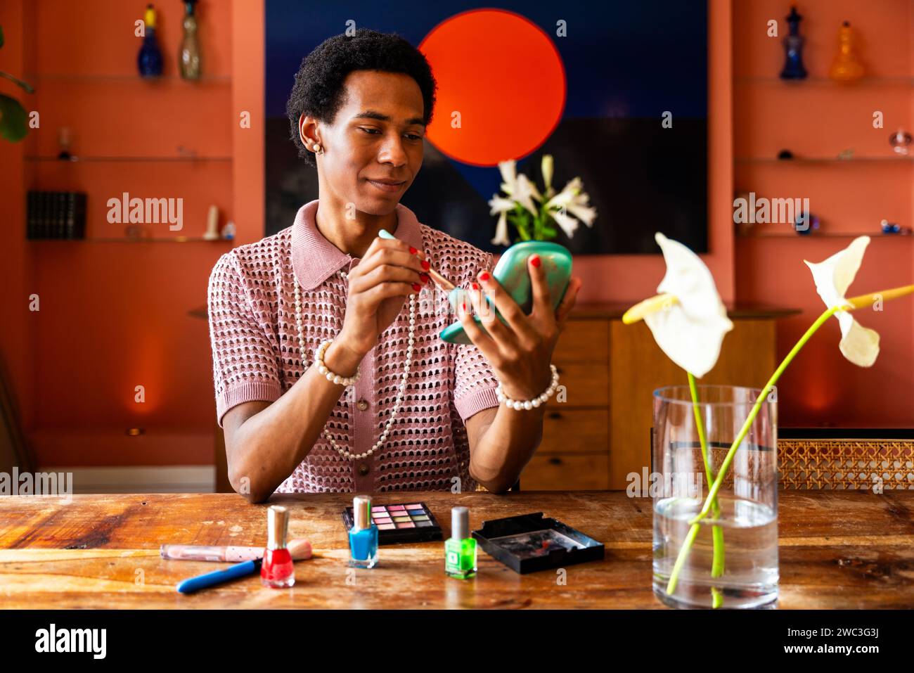 Fluid gender young man wearing cross dressing clothing at home, LGBTQ ...