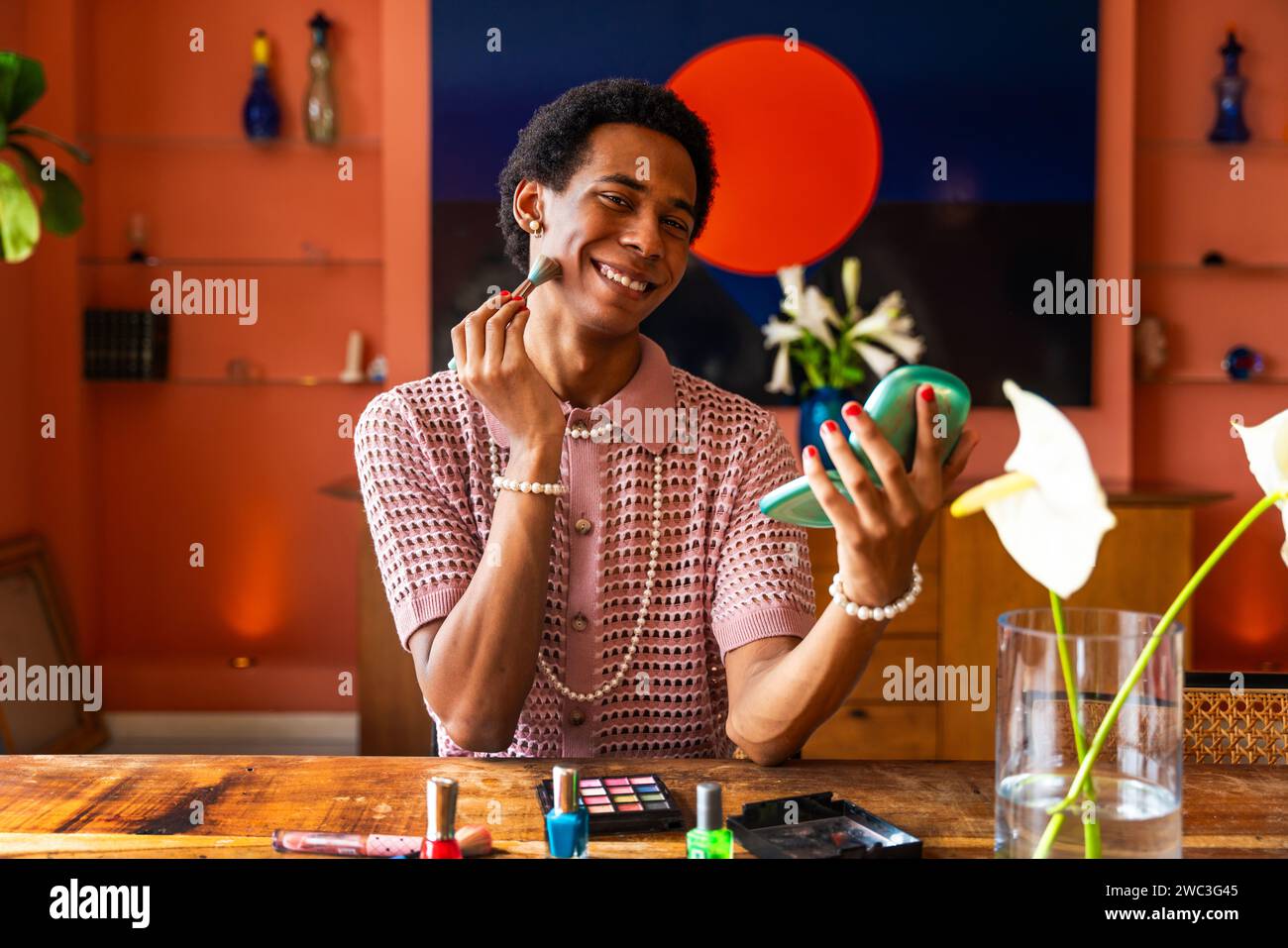 Fluid gender young man wearing cross dressing clothing at home, LGBTQ ...