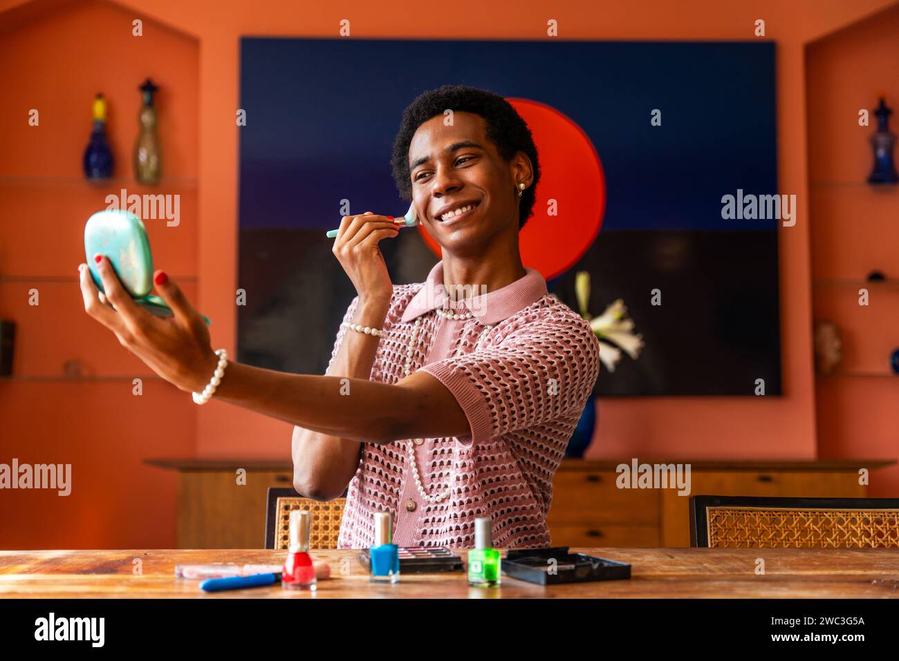 Fluid gender young man wearing cross dressing clothing at home, LGBTQ ...