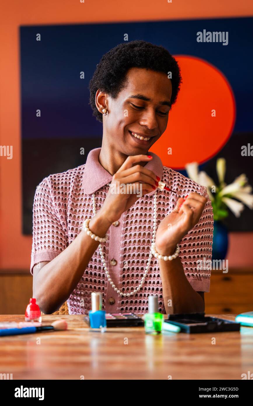 Fluid gender young man wearing cross dressing clothing at home, LGBTQ ...