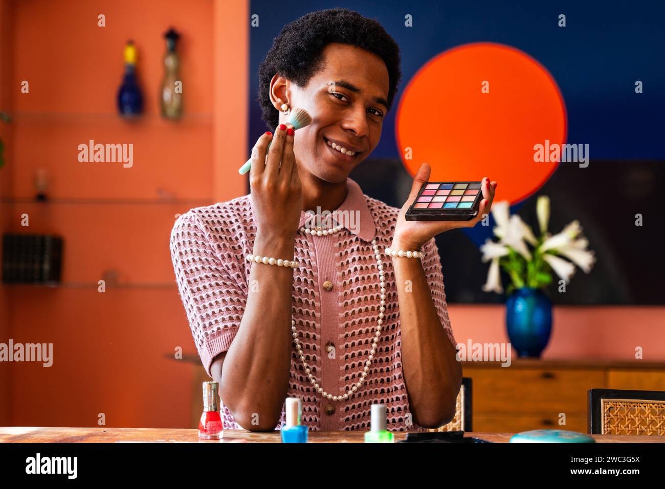 Fluid gender young man wearing cross dressing clothing at home, LGBTQ ...