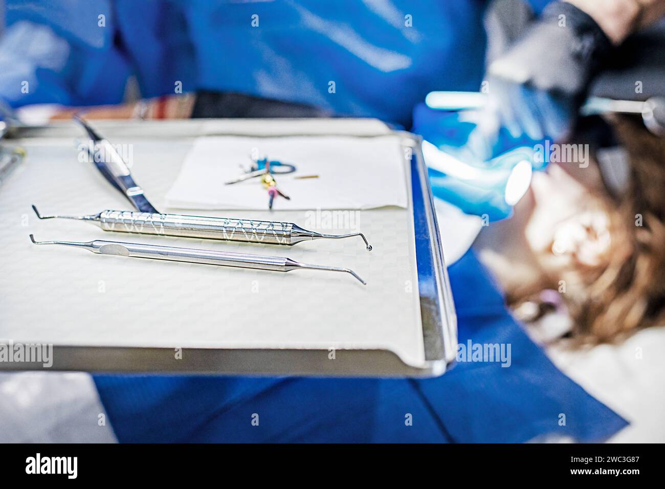 dental instruments for filling and treating teeth on a light background ...