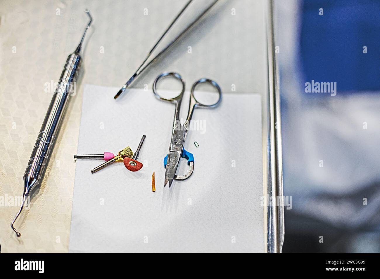 dental instruments for filling and treating teeth on a light background ...