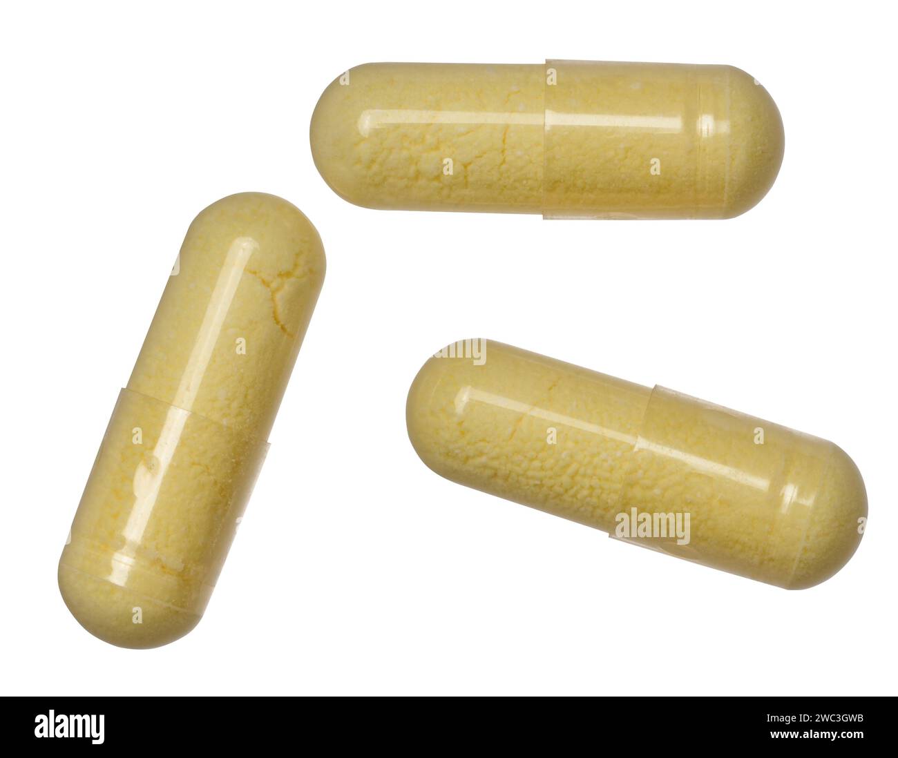 Transparent capsule with yellow powder on isolated background, medical ...