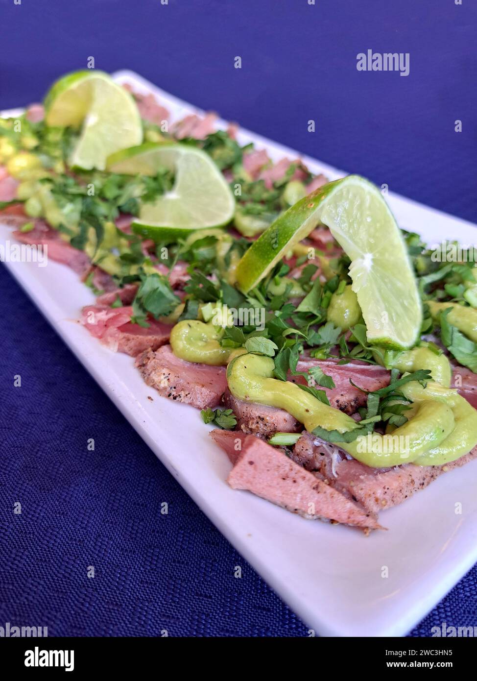 Tuna tiradito is a dish of Peruvian origin that consists of raw fish ...
