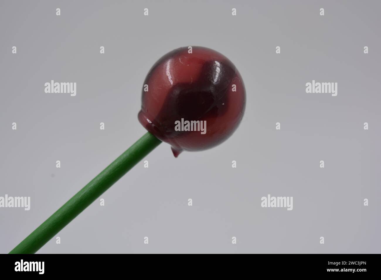 Bright natural sucking candies, lollipops on sticks in colored ...