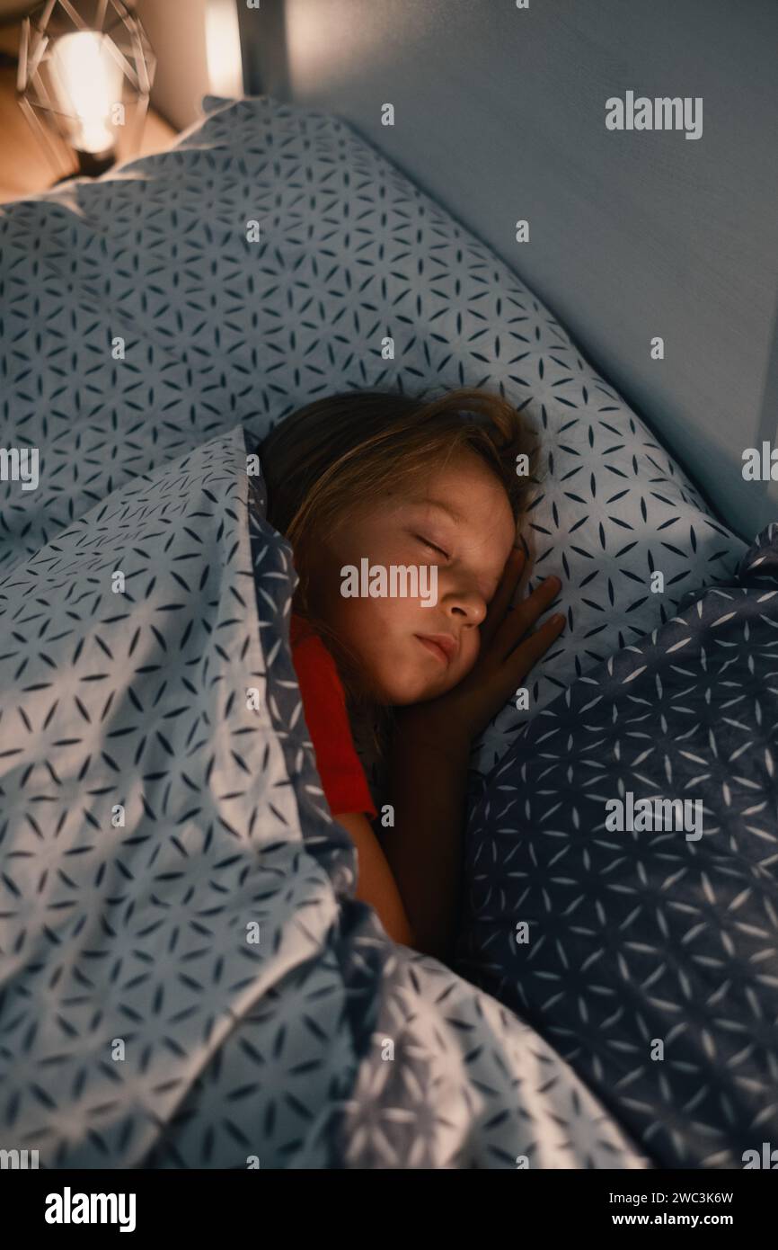Child sleeping at night. Comfortable bed for kids. Toddler girl ...