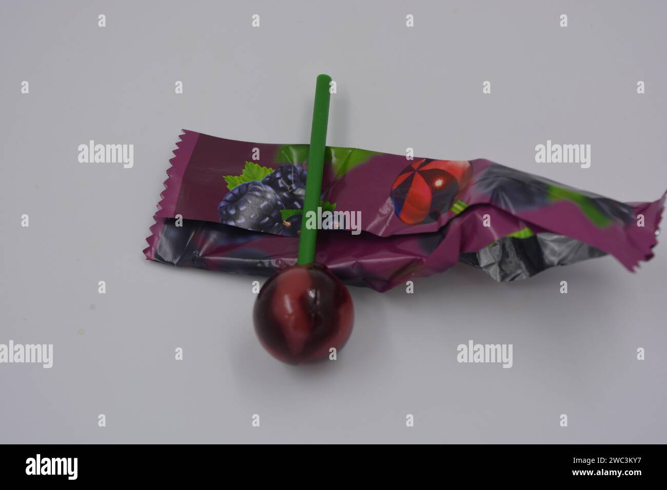 Bright natural sucking candies, lollipops on sticks in colored ...