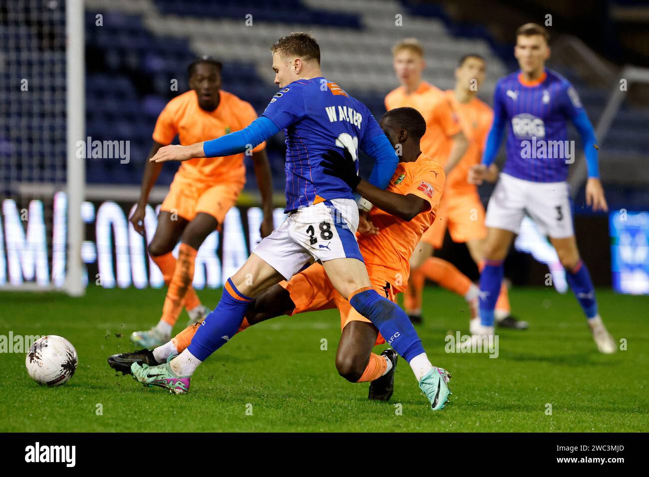 Ethan Walker of Oldham Athletic Association Football Club is fouled by ...