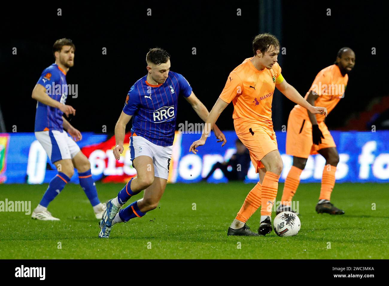 Josh Lundstram of Oldham Athletic Association Football Club is tussling ...