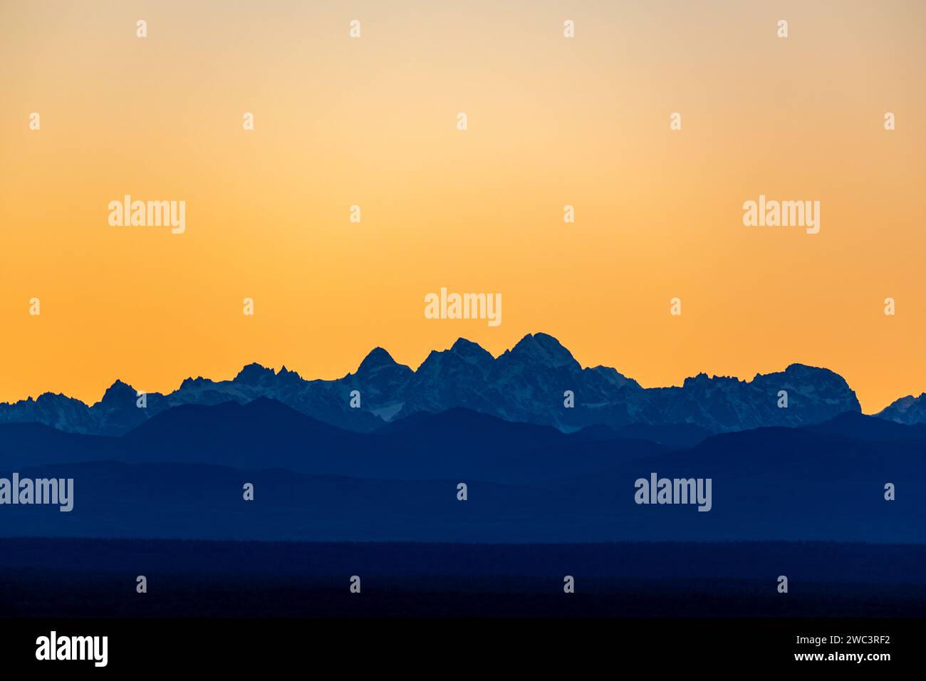 View of rugged Alaska Mountain range in sunset twilight light with ...