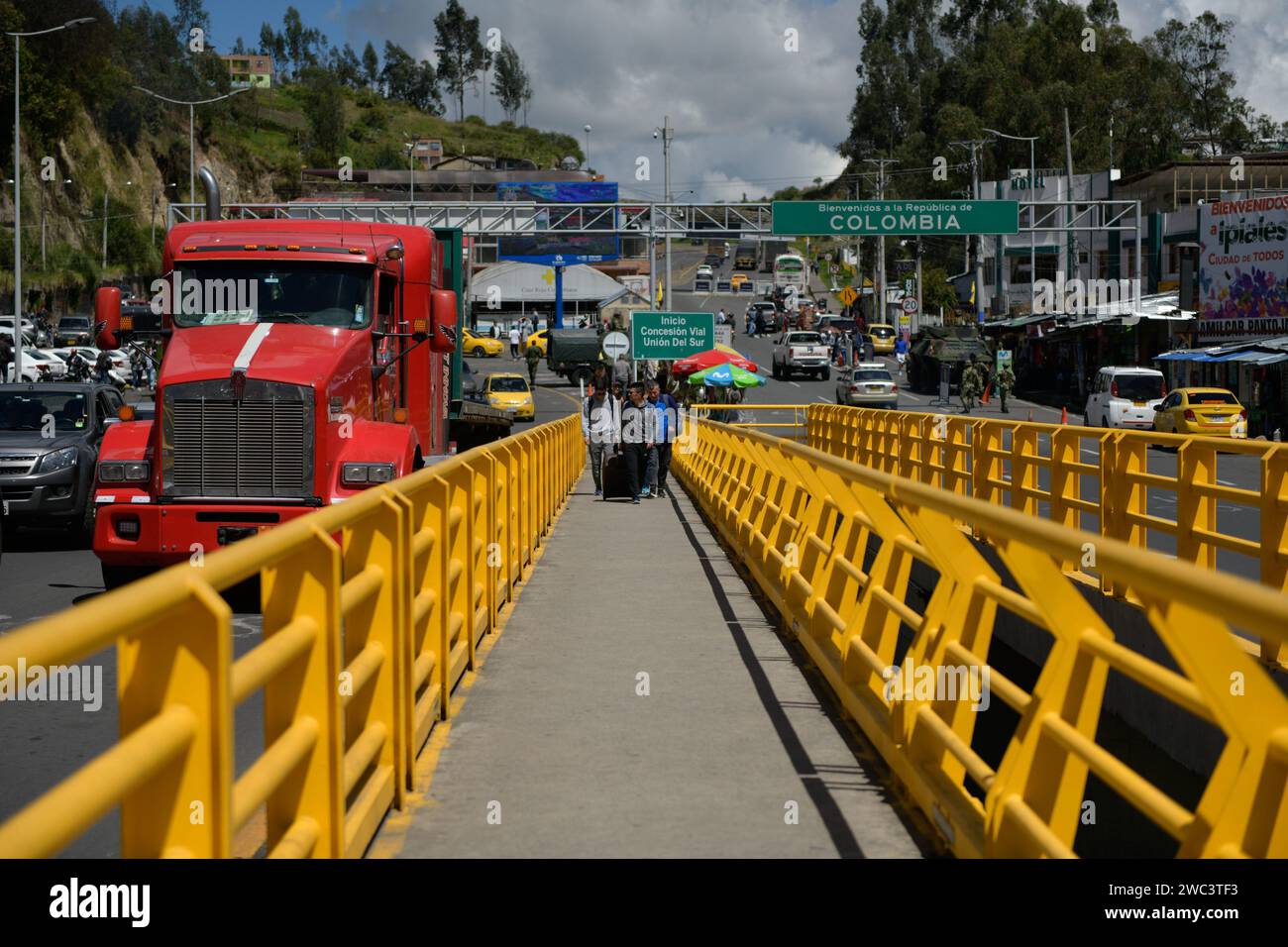 Tulcan, Ecuador. 13th Jan, 2024. People are seen crossing the Rumichaca ...
