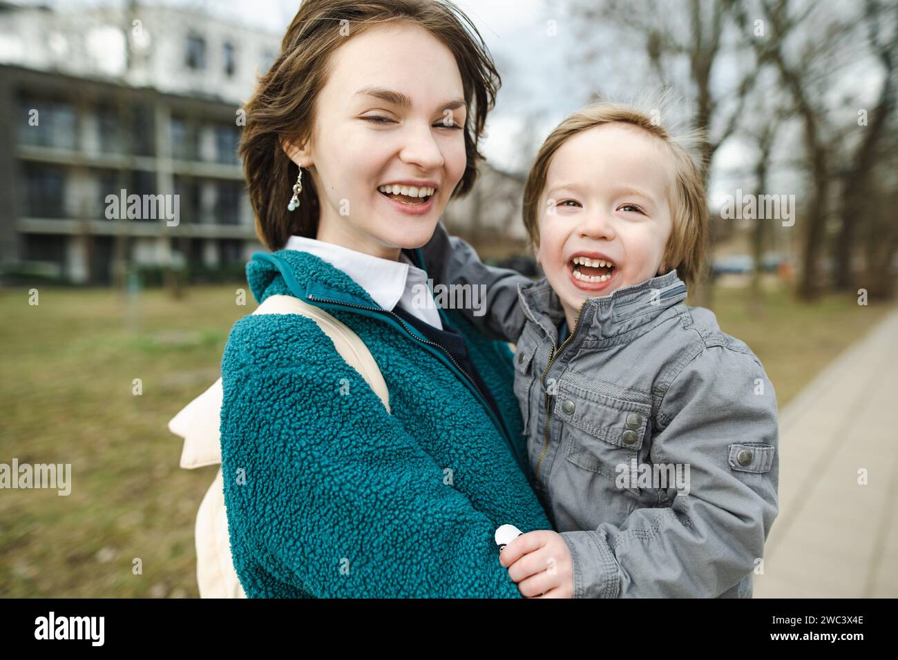 Cute big sister cuddling with her toddler brother. Adorable teenager ...
