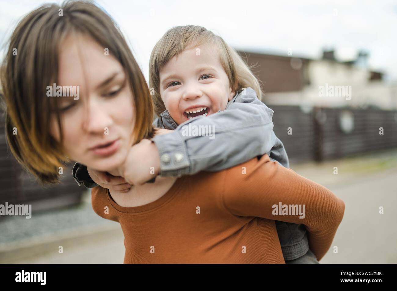 Cute big sister cuddling with her toddler brother. Adorable teenager ...