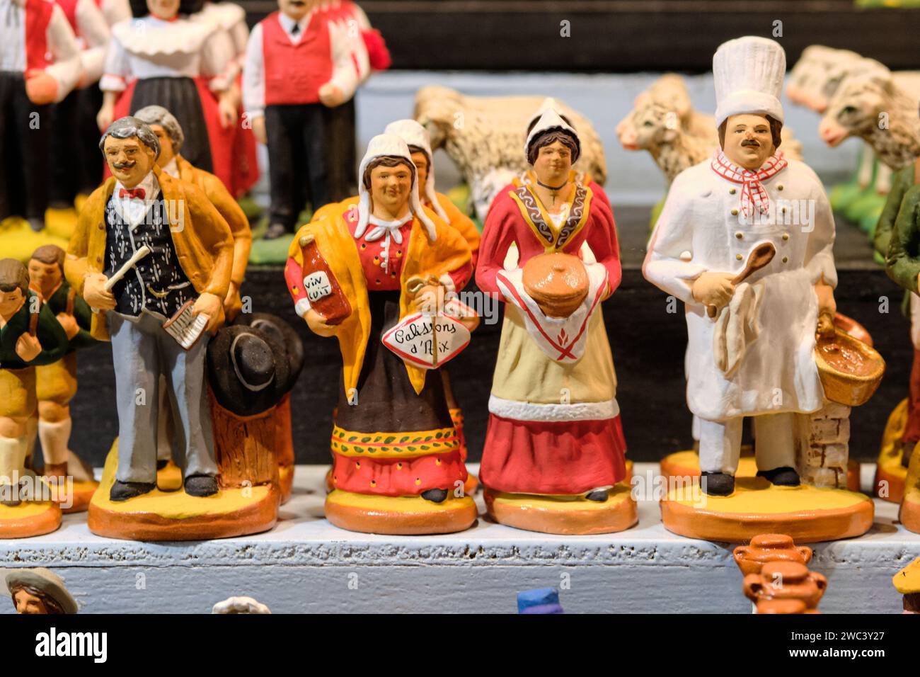 Display of Santon figurines with focus on cooking workers for sale in a ...