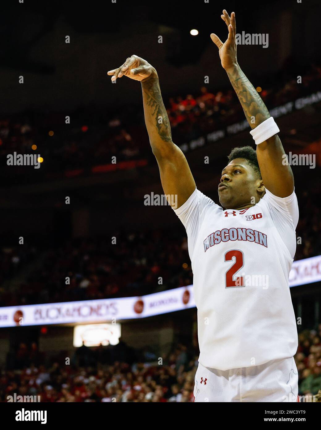 Madison, WI, USA. 13th Jan, 2024. Wisconsin Badgers guard AJ Storr (2) makes a 3 point shot ...
