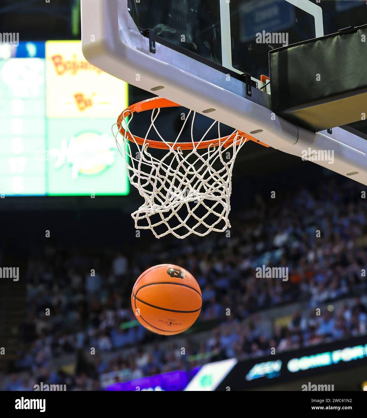 January 13, 2024: Basketball going through hoop. NCAA basketball game ...