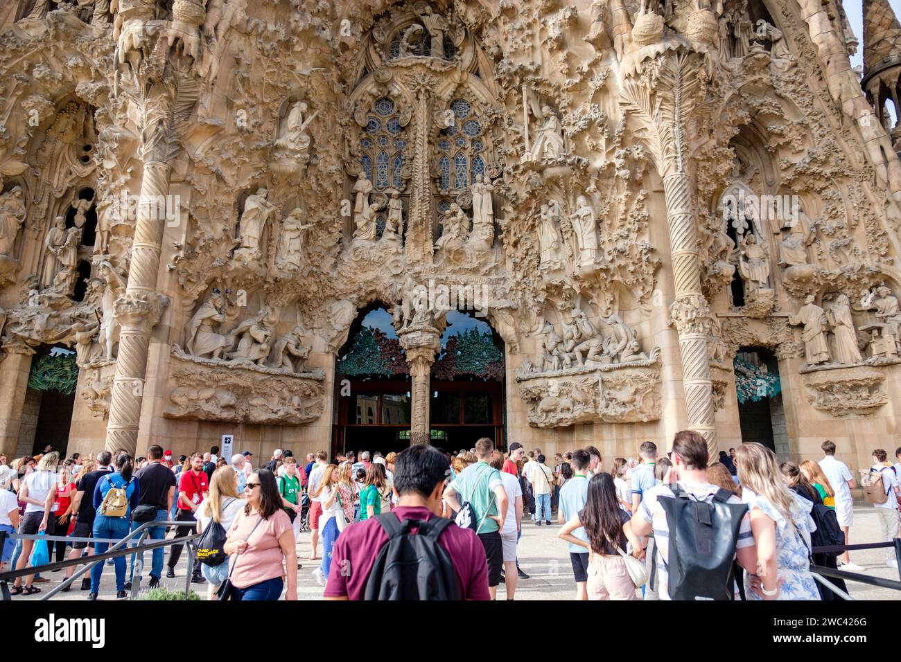 Overtourism, tourist crowd waiting outside in front of busy Nativity ...
