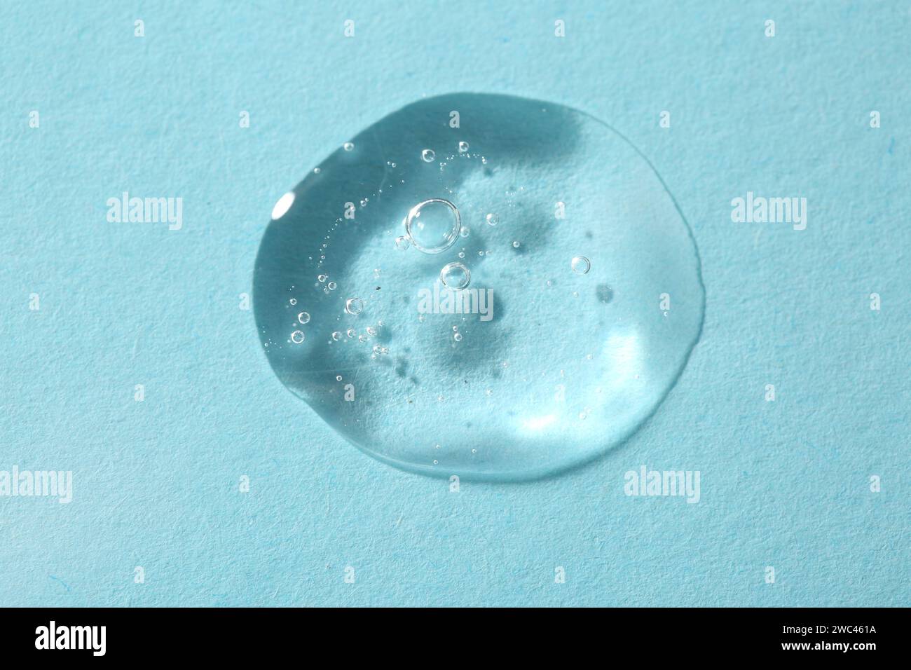 Sample of cosmetic serum on light blue background, above view Stock ...