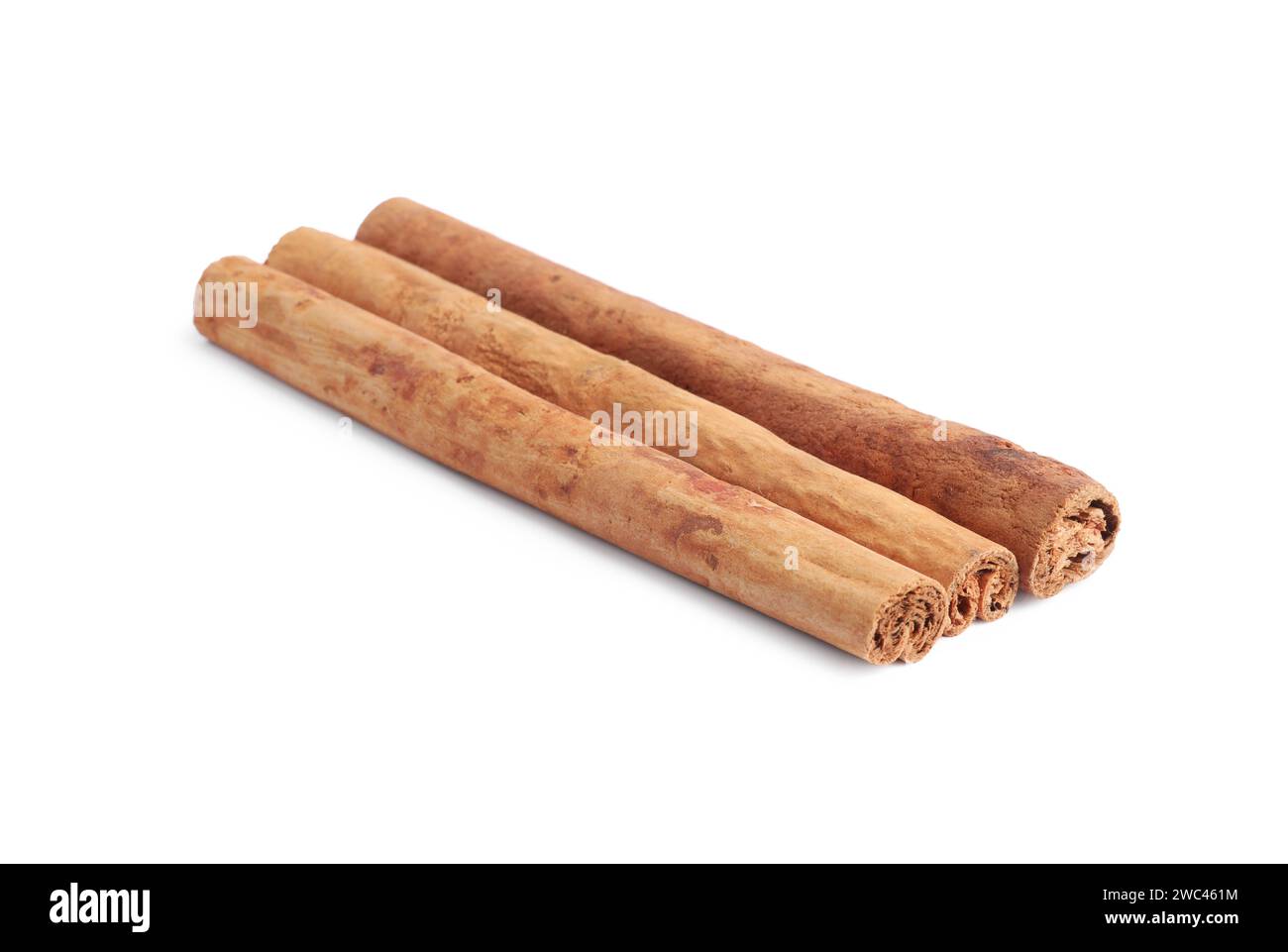 Dry aromatic cinnamon sticks isolated on white Stock Photo - Alamy